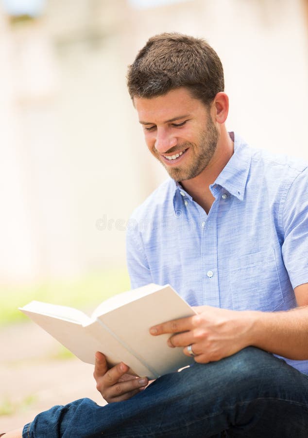Man reading book outside stock image. Image of looking - 42018595
