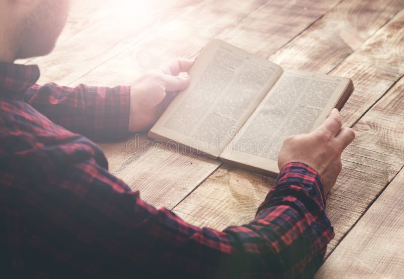 Man Reading Book Sitting at a Wooden Table Stock Image - Image of break ...