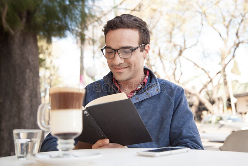Man Reading a Book in the Street Stock Photo - Image of attractive ...