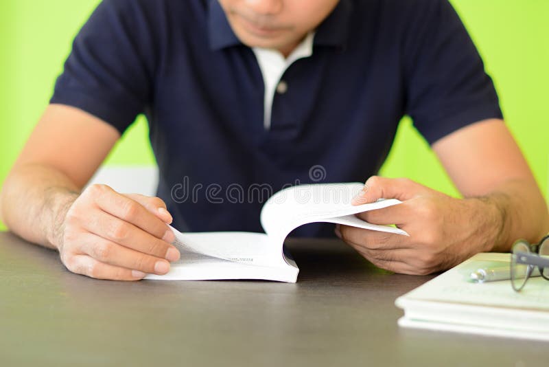 A Man Reading Book on the Table Stock Photo - Image of student, concept ...
