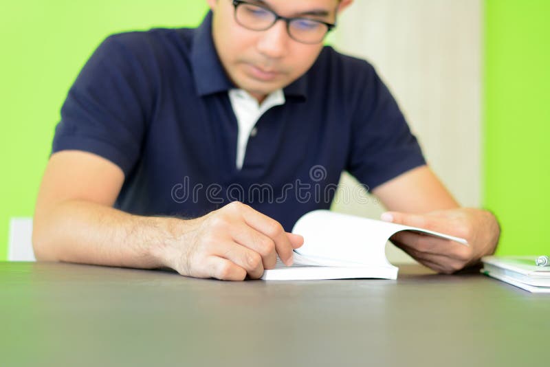 A Man Reading Book on the Table Stock Photo - Image of knowledge ...