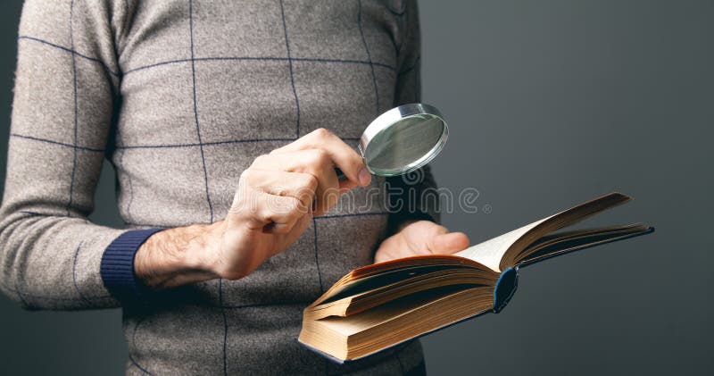 Magnifier and book stock photo. Image of information - 234157442