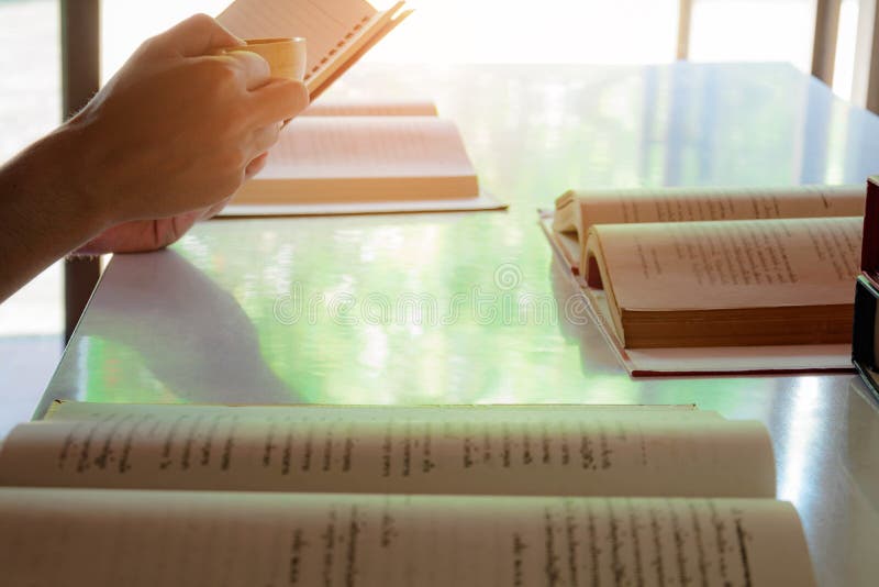 Man Reading a Book on White Table Stock Photo - Image of business, home ...
