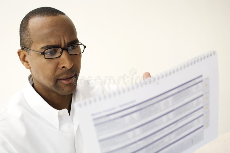 Man Reading a Document stock image. Image of businessperson - 29661199