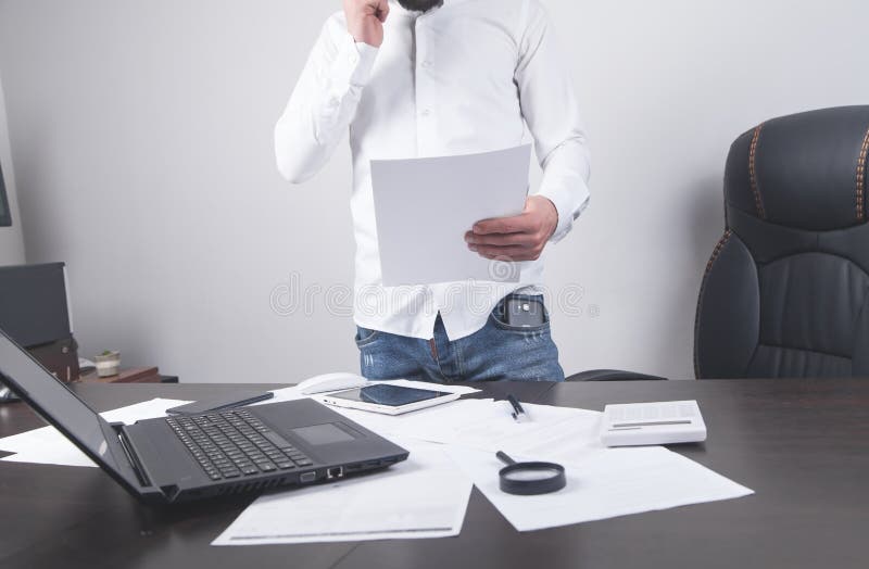 Man Reading Document in Office. Business Stock Image - Image of person ...