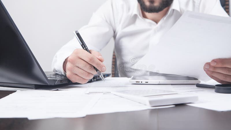 Man Reading Document in Office. Business Stock Image - Image of reading ...