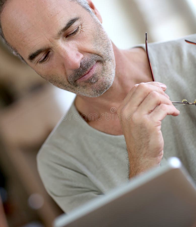 Man Reading Ebook on Digital Tablet Stock Photo - Image of people ...
