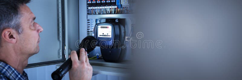 Man Reading Electric Meter with Flashlight Stock Photo - Image of ...