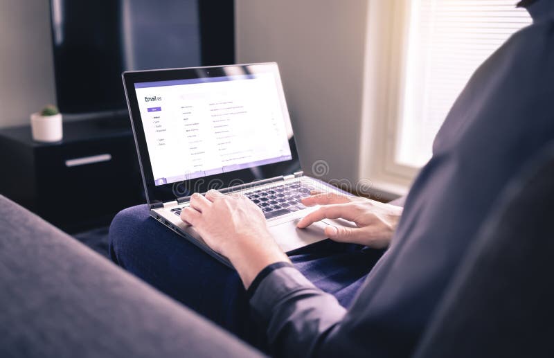 Man Reading Email and Using Laptop in Home Living Room. Checking ...