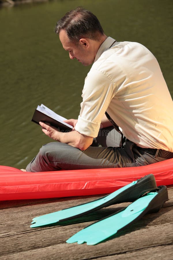 Man reading his notes stock photo. Image of resting, outdoor - 10368922