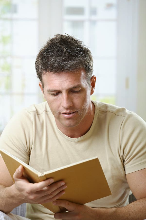 Reading at home stock image. Image of manhood, read, rest - 1119665