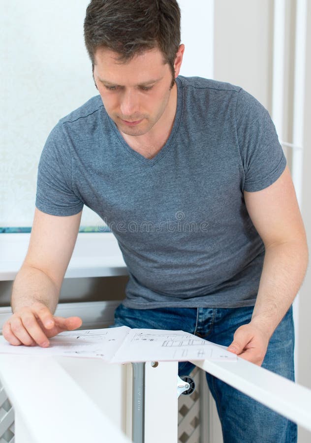 Man is Reading the Instructions. Stock Image - Image of handsome ...
