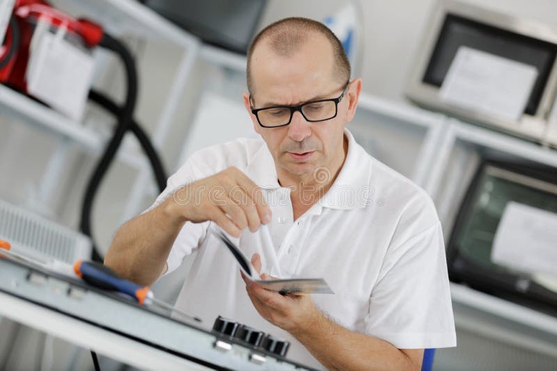 Man Reading Instructions for Electrical Appliance Stock Photo - Image ...