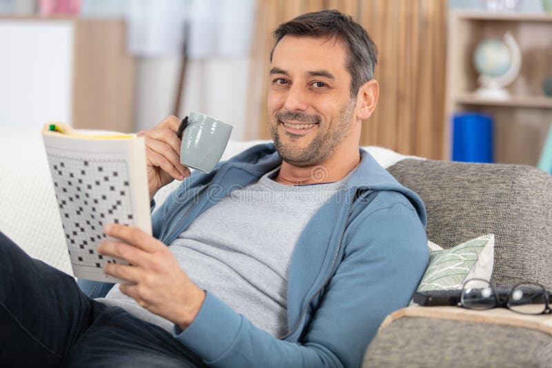 Man Reading Magazine Holding Cup Coffee Stock Image - Image of comfort ...