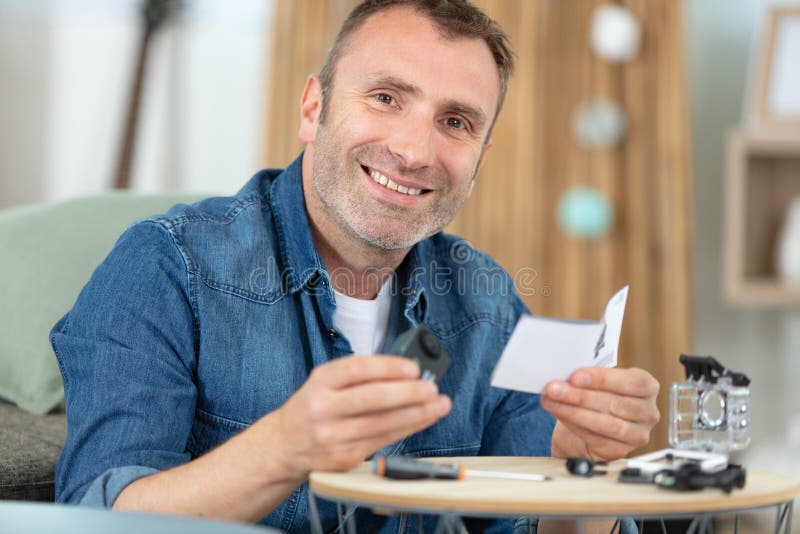Man Reading Manual New Camera Stock Photo - Image of mobile, friendship ...