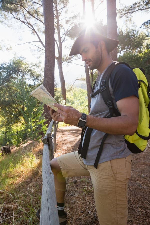 Man Reading the Map Near the Wooden Fence Stock Image - Image of nature ...