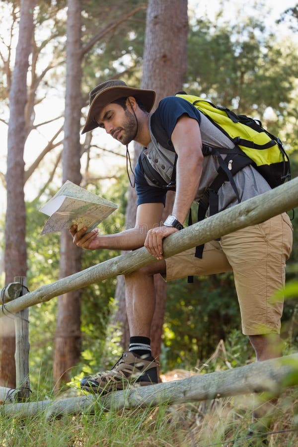 Man Reading the Map Near the Wooden Fence Stock Image - Image of ...