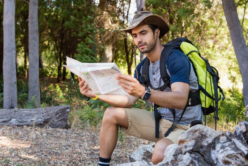 Man Reading the Map while Resting in the Forest Stock Photo - Image of ...