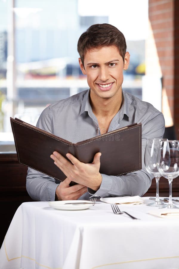 Man Reading Menu at Restaurant Stock Image - Image of drink, decision ...