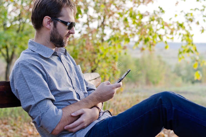 Man reading a message stock image. Image of sunglasses - 29561051