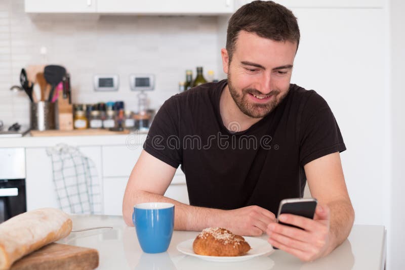 Man Reading News on His Mobile Phone in the Morning Stock Image - Image ...