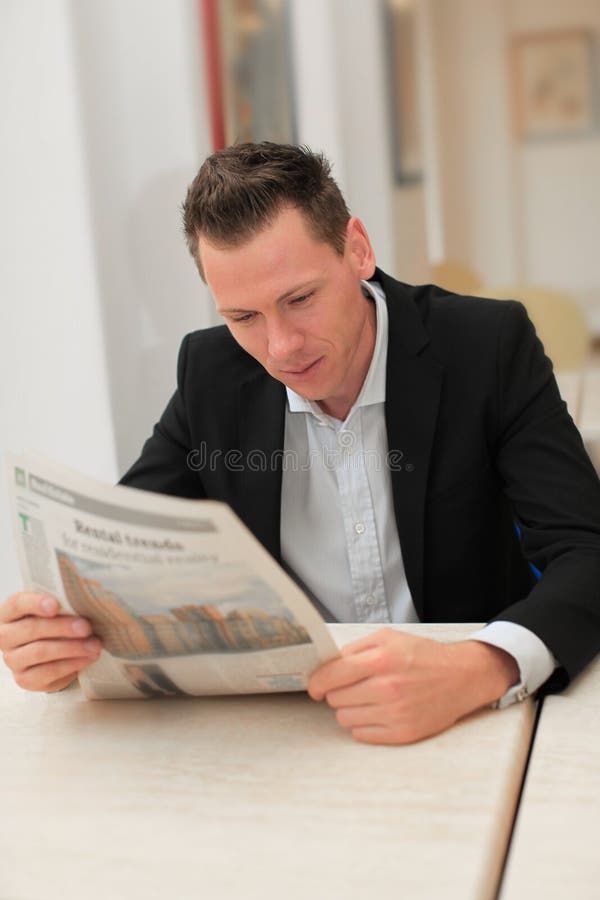 Man reading newspaper stock image. Image of business - 15825543