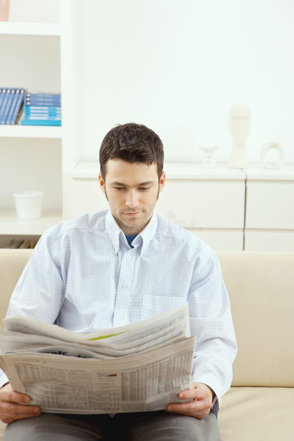 Man reading newspaper stock photo. Image of couch, focusing - 9101472