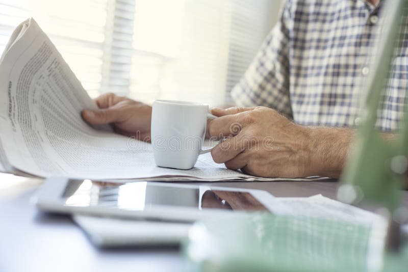 Man Reading Newspaper on Table Stock Image - Image of publishing ...