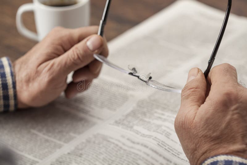 Man Reading Newspaper on Table Stock Image - Image of close, read: 83528069