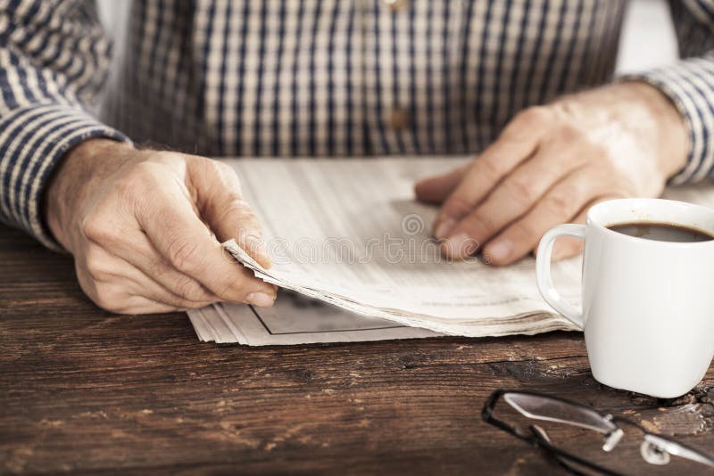 Man Reading Newspaper on Table Stock Image - Image of close, economy ...