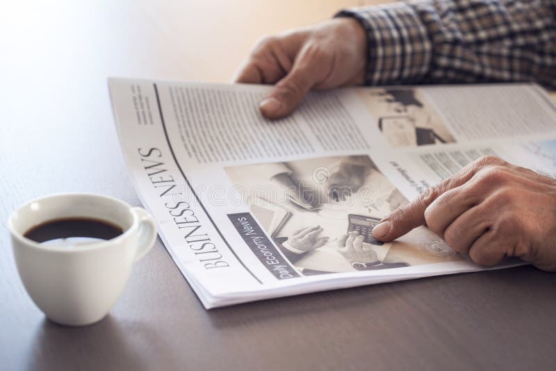 Man Reading Newspaper on Table Stock Image - Image of journal, reading ...