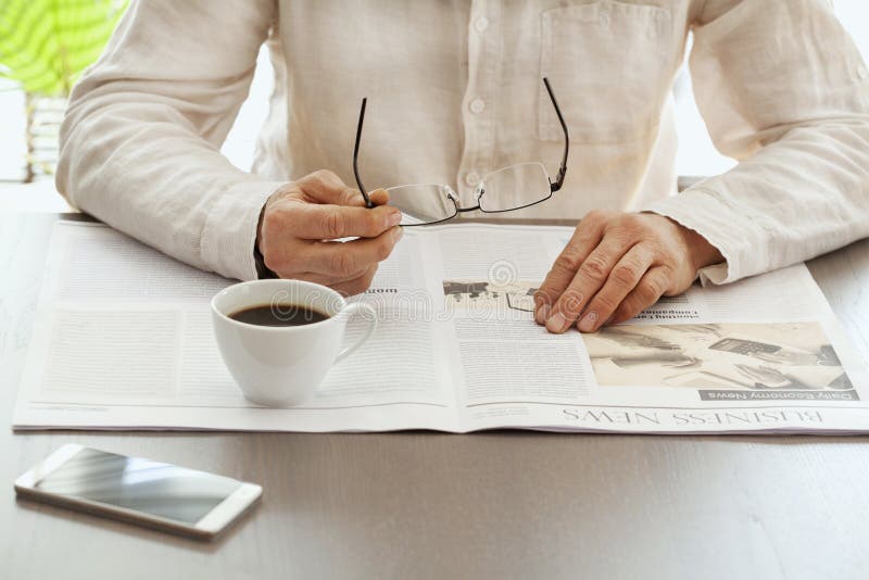 Man Reading Newspaper on Table Stock Photo - Image of economy ...