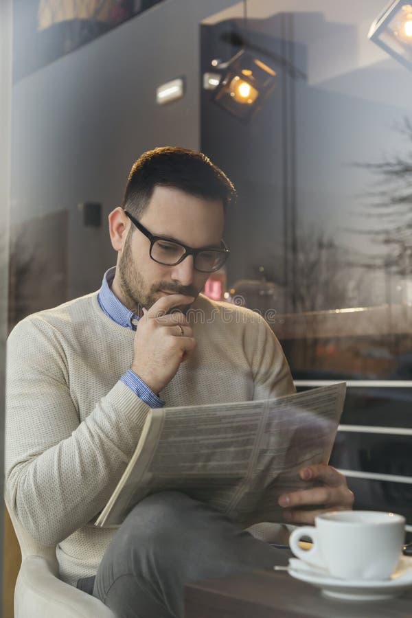 Man reading newspapers stock photo. Image of display - 153968648