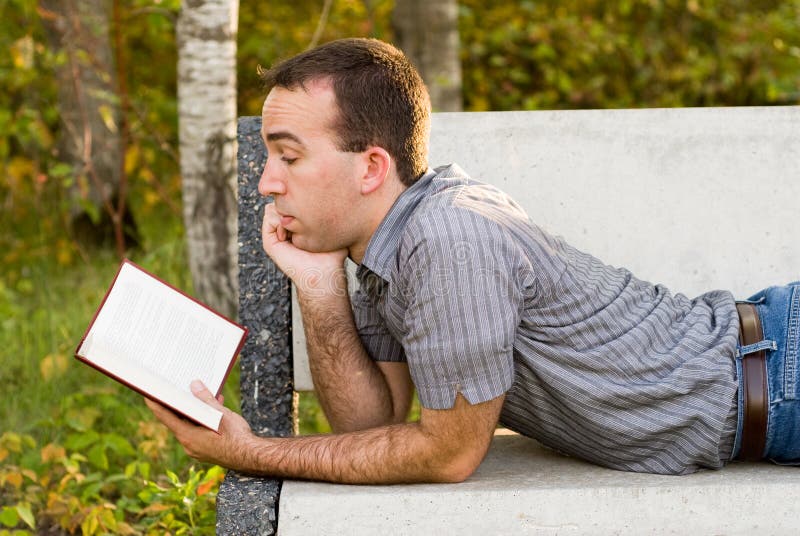 Man Reading a Novel stock photo. Image of grass, seat - 6449318