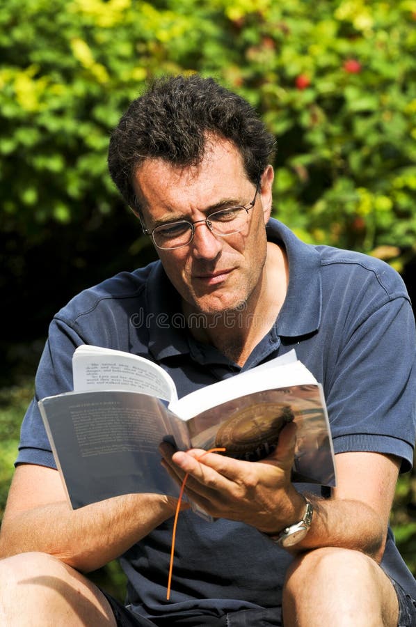 Man reading a novel stock photo. Image of fiction, story - 7031542