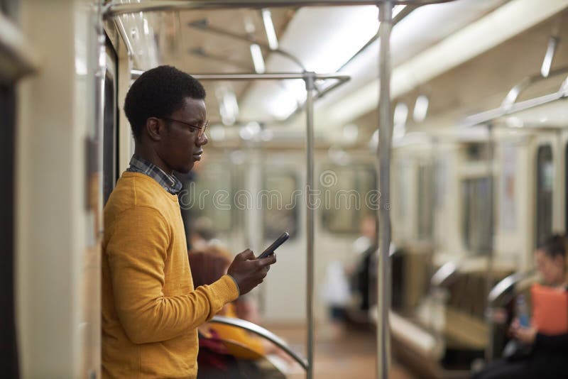 Man Reading Online in Subway Car Stock Image - Image of public ...