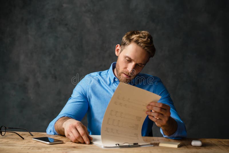The Man Reading Paper while Sitting in the Studio Stock Image - Image ...