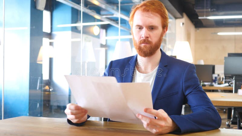 Man Reading Papers in Office Stock Image - Image of attend, info: 98567487