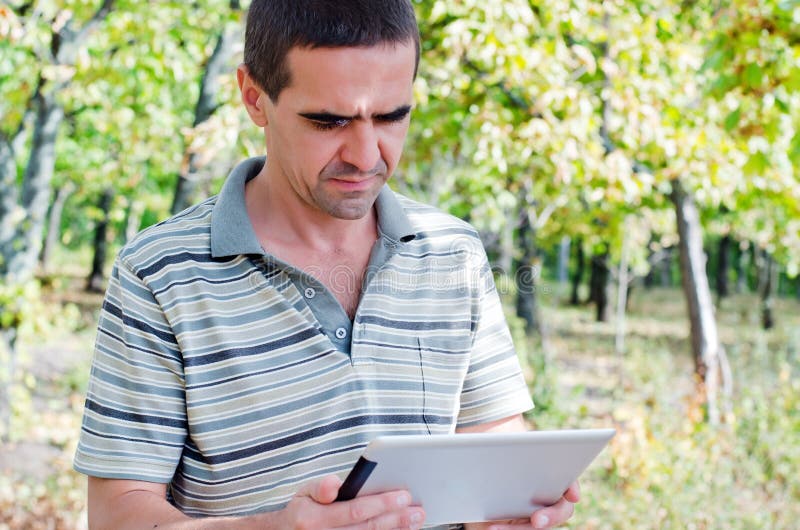 Man Reading the Screen on His Tablet Stock Image - Image of ...