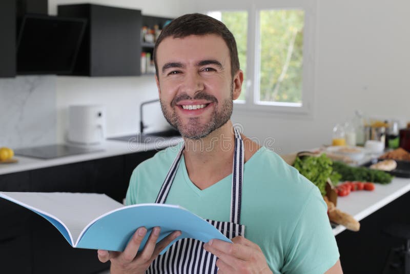Man Reading Some Notes before Making Some Food in the Kitchen Stock ...