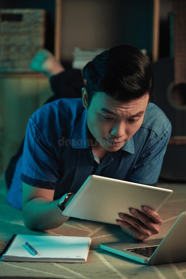 Man Reading Something on Tablet Computer Stock Photo - Image of reading ...