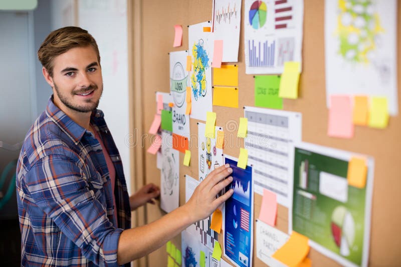 Man Reading Sticky Notes on the Board in Office Stock Photo - Image of ...