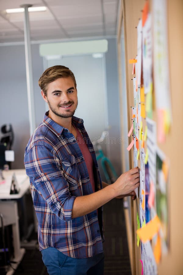 Man Reading Sticky Notes on the Board in Office Stock Image - Image of ...