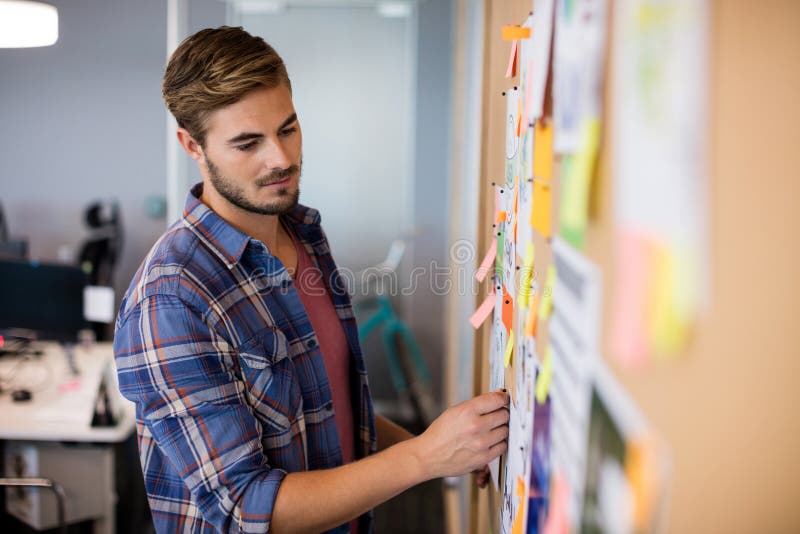 Man reading sticky notes stock image. Image of sticky - 88943547