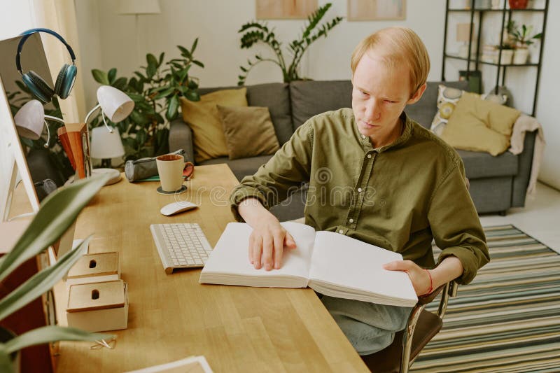 Man Reading at Table stock image. Image of hobby, language - 336590435