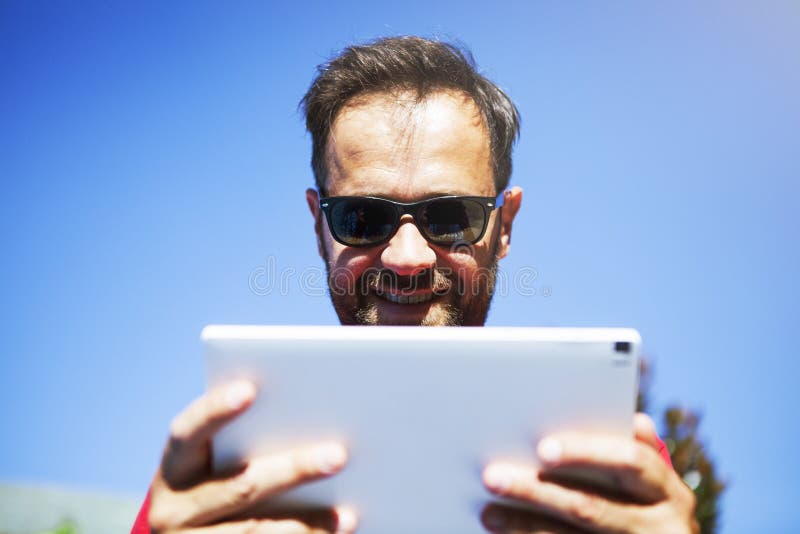 Man Reading a Tablet. Zoom Effect. Stock Photo - Image of face ...