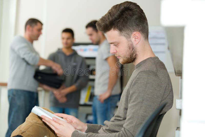 Man Reading while in Waiting Area Stock Image - Image of indoor ...