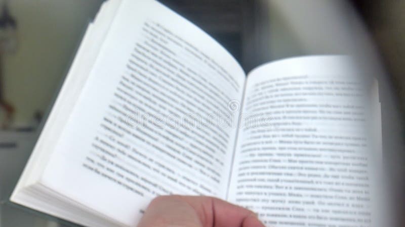 A Man Reads a Book, a First-person View Stock Footage - Video of lens ...