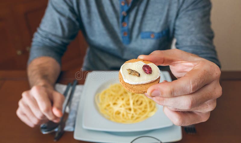 Man eating crickets canape stock image. Image of cricket - 168594015