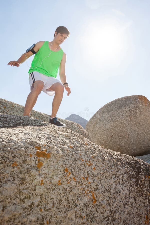 Man Ready To Jump from Rock Stock Image - Image of male, handsome: 91797637